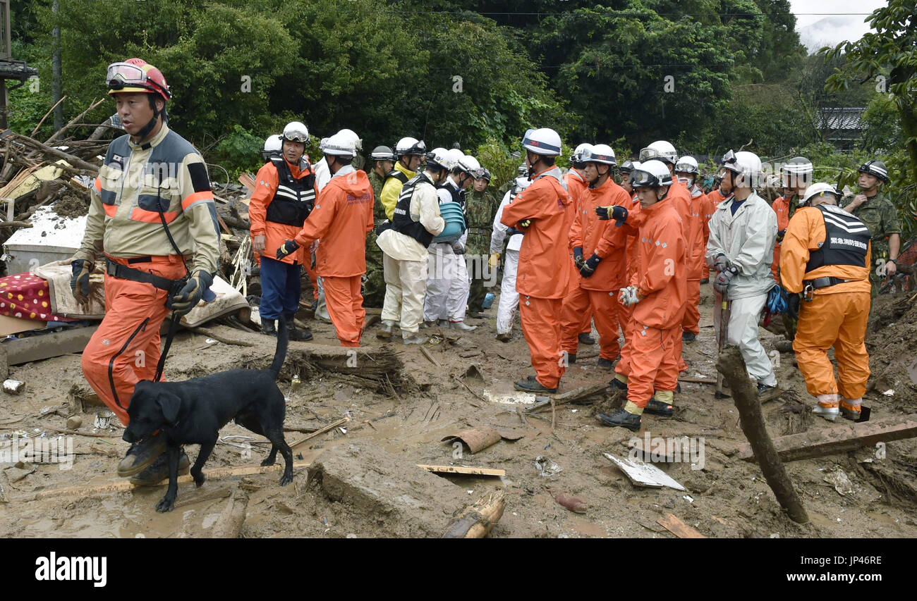 HIROSHIMA, Japan - Rescue workers search for missing people with ...