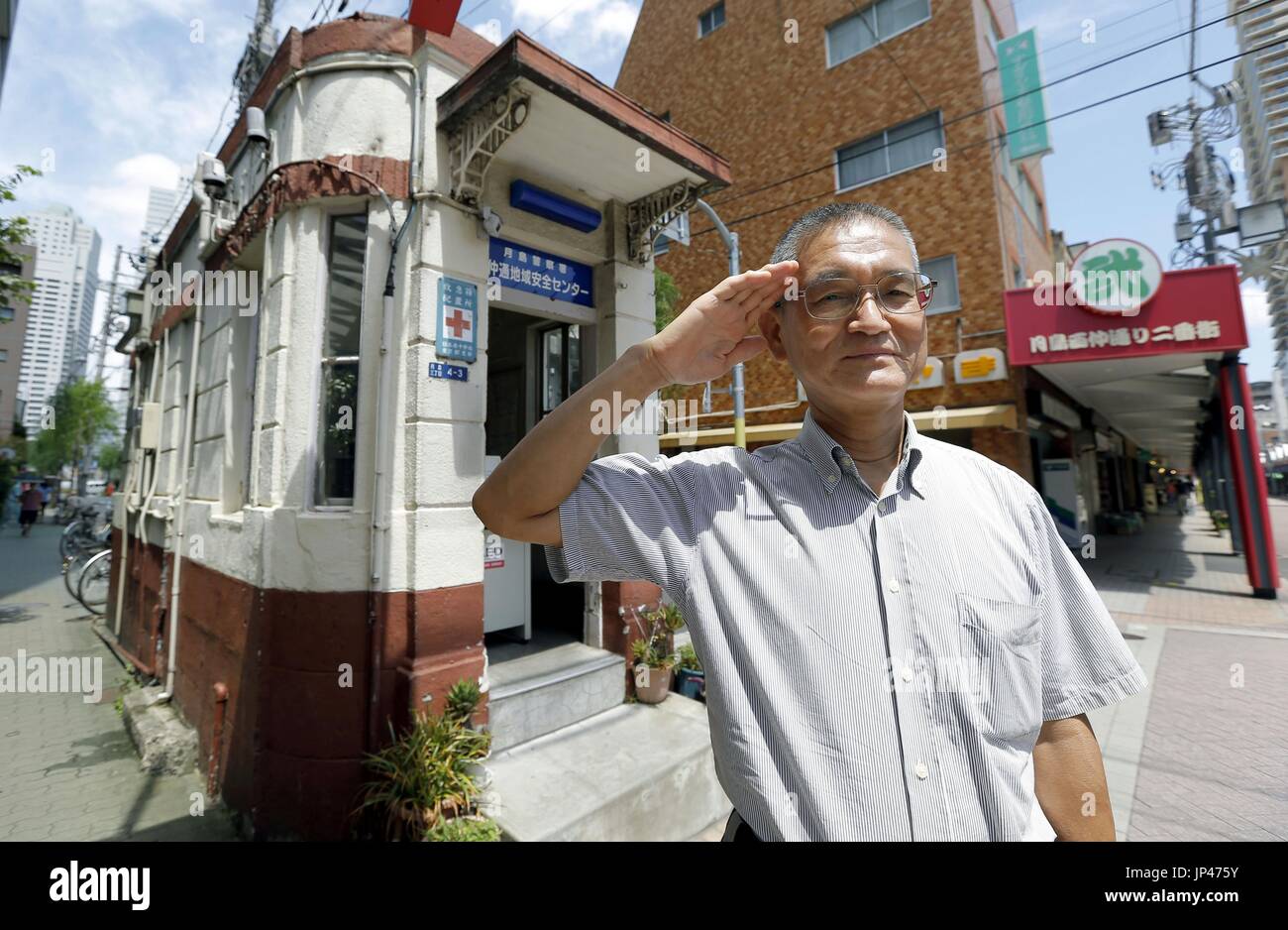TOKYO, Japan - Former police sergeant Takeshi Nakamura salutes in front ...
