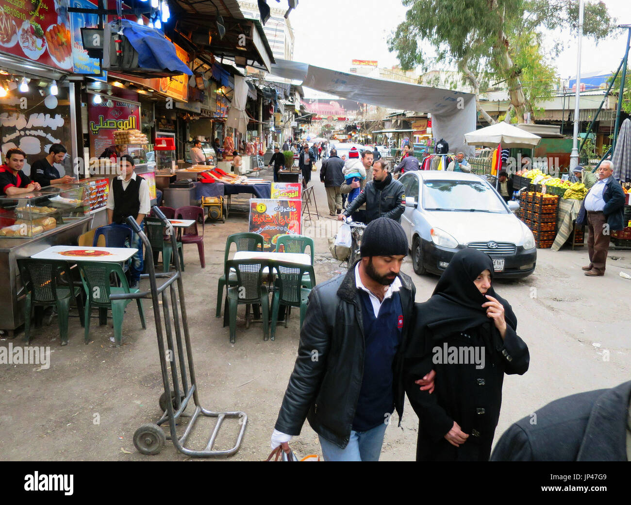 DAMASCUS, Syria - Photo shows a sparsely crowded downtown area of ...