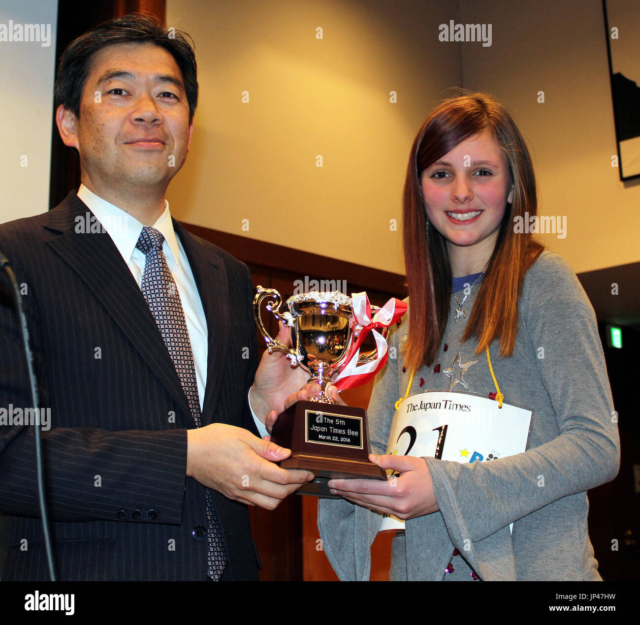 TOKYO, Japan - Michaella Bostrom, 14, receives the winner's trophy for ...