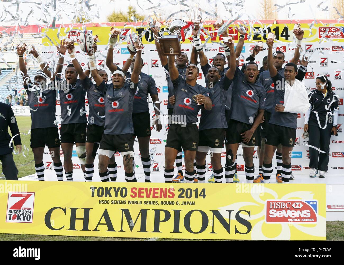 TOKYO, Japan - Fiji players celebrate at the podium after winning the ...