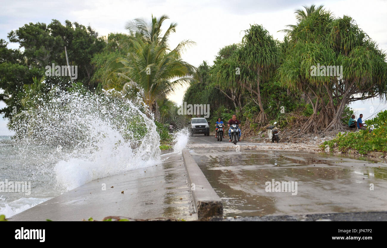 FUNAFUTI, Tuvalu - Photo shows a road battered by waves in Funafuti ...
