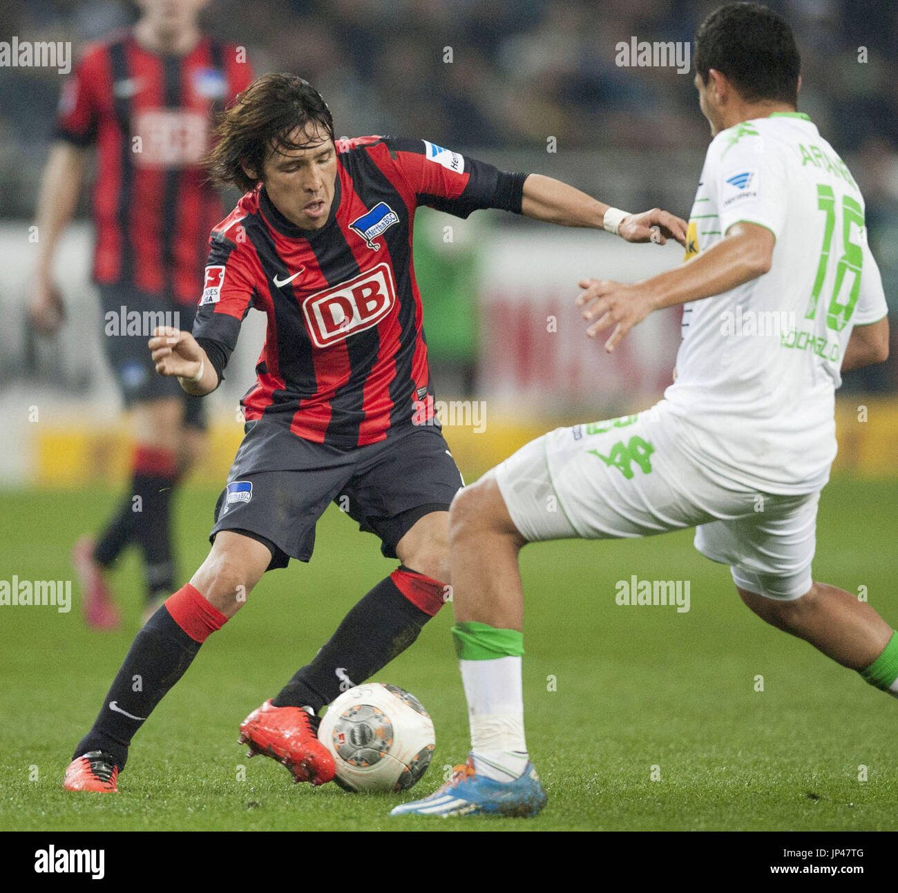 MONCHENGLADBACH, Germany - Japanese footballer Hajime Hosogai (L) of ...
