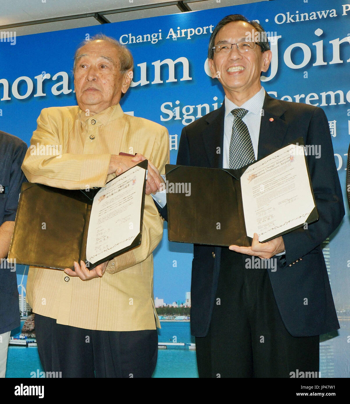 NAHA, Japan - Okinawa Gov. Hirokazu Nakaima (L) and Wong Woon Liong ...