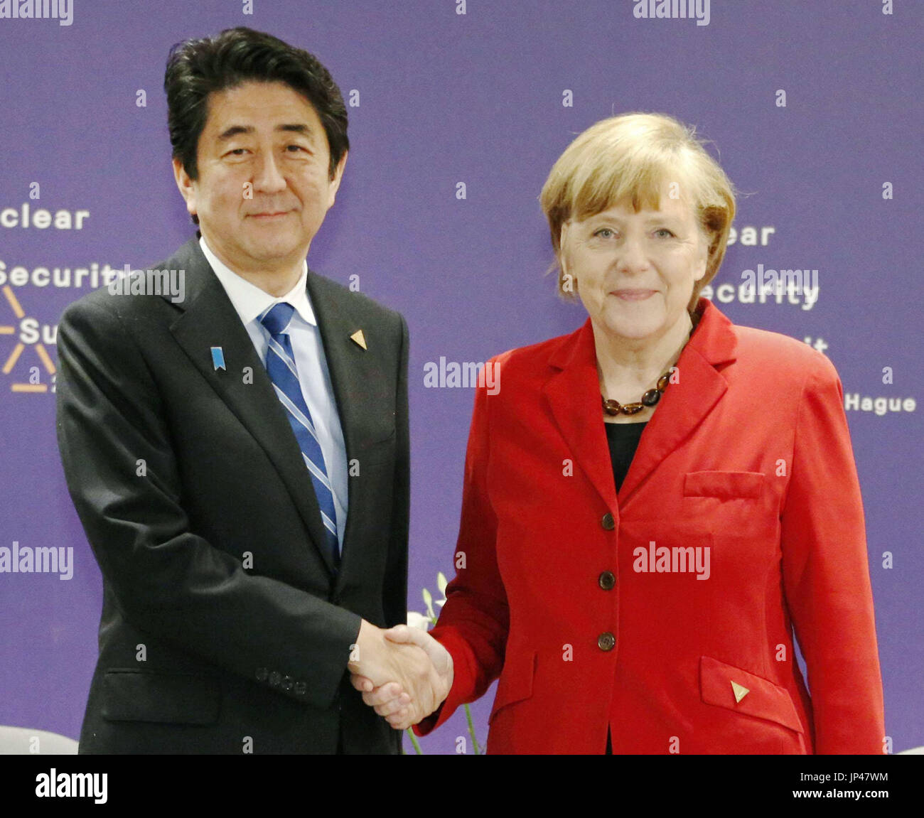 THE HAGUE, Netherlands - Japanese Prime Minister Shinzo Abe (L) and ...