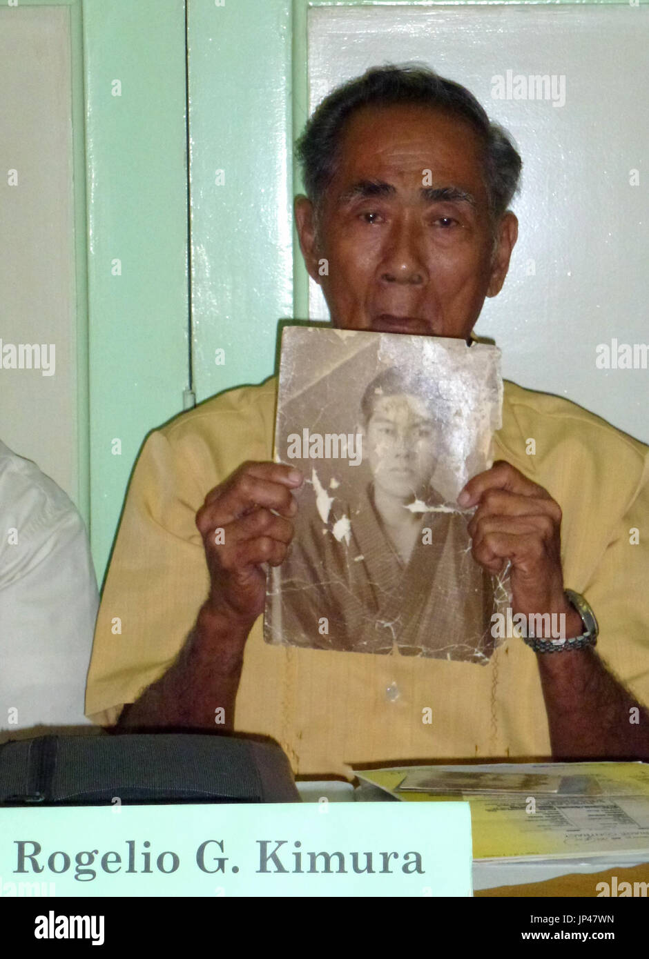 MANILA, Philippines - Rogelio Kimura, 69, holds a photo of his Japanese ...