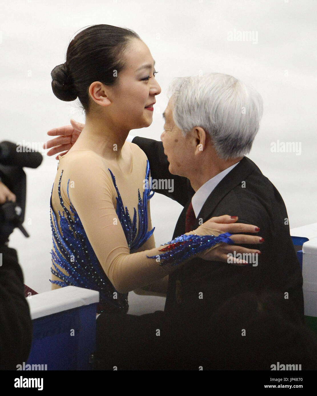 SAITAMA, Japan - Japan's Mao Asada (L) and her coach Nobuo Sato hug ...