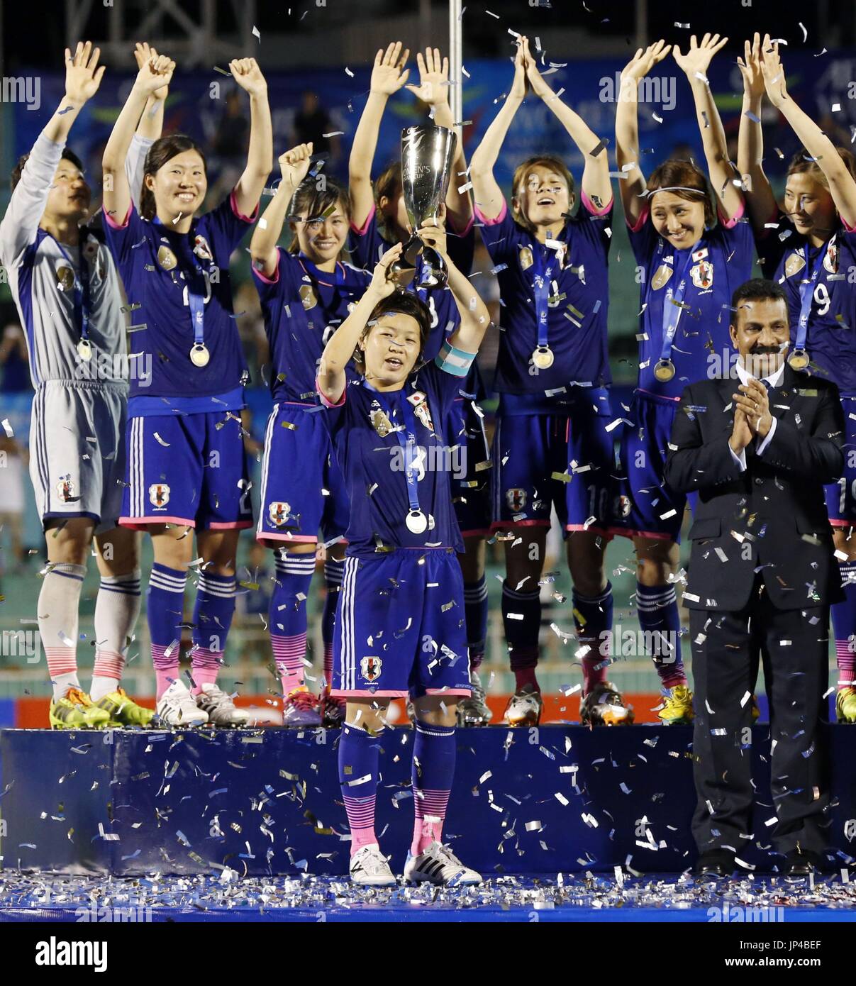 HO CHI MINH CITY, Vietnam - Captain Aya Miyama holds the trophy as ...