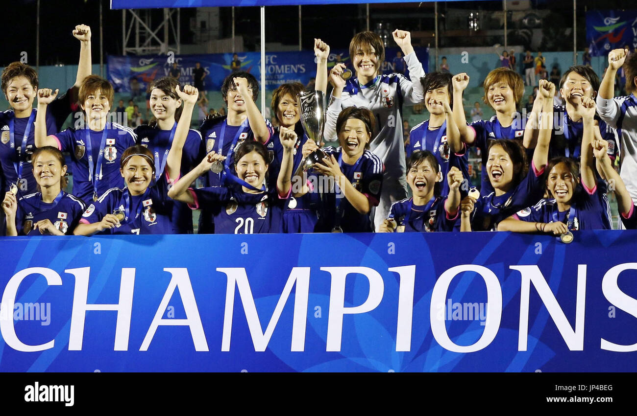 HO CHI MINH CITY, Vietnam - Captain Aya Miyama holds the trophy as ...