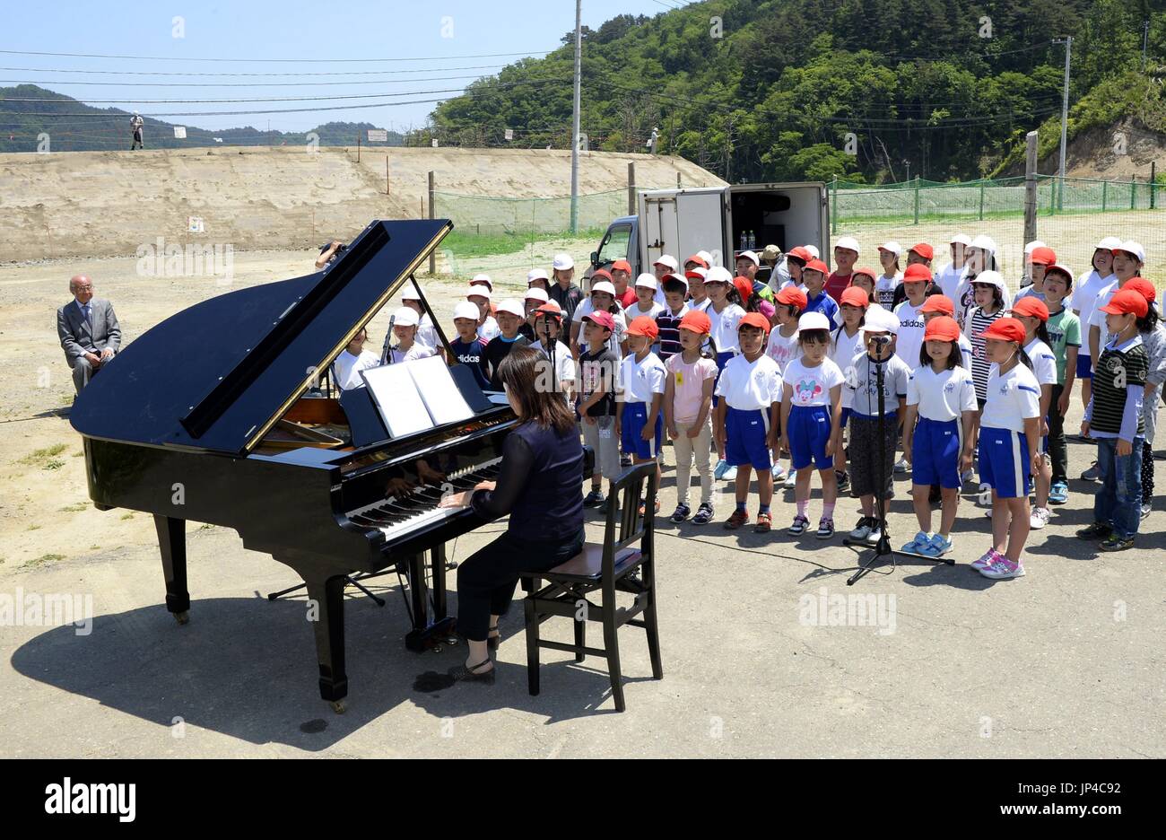 KAMAISHI, Japan - Pupils of Toni Elementary School sing a school song ...