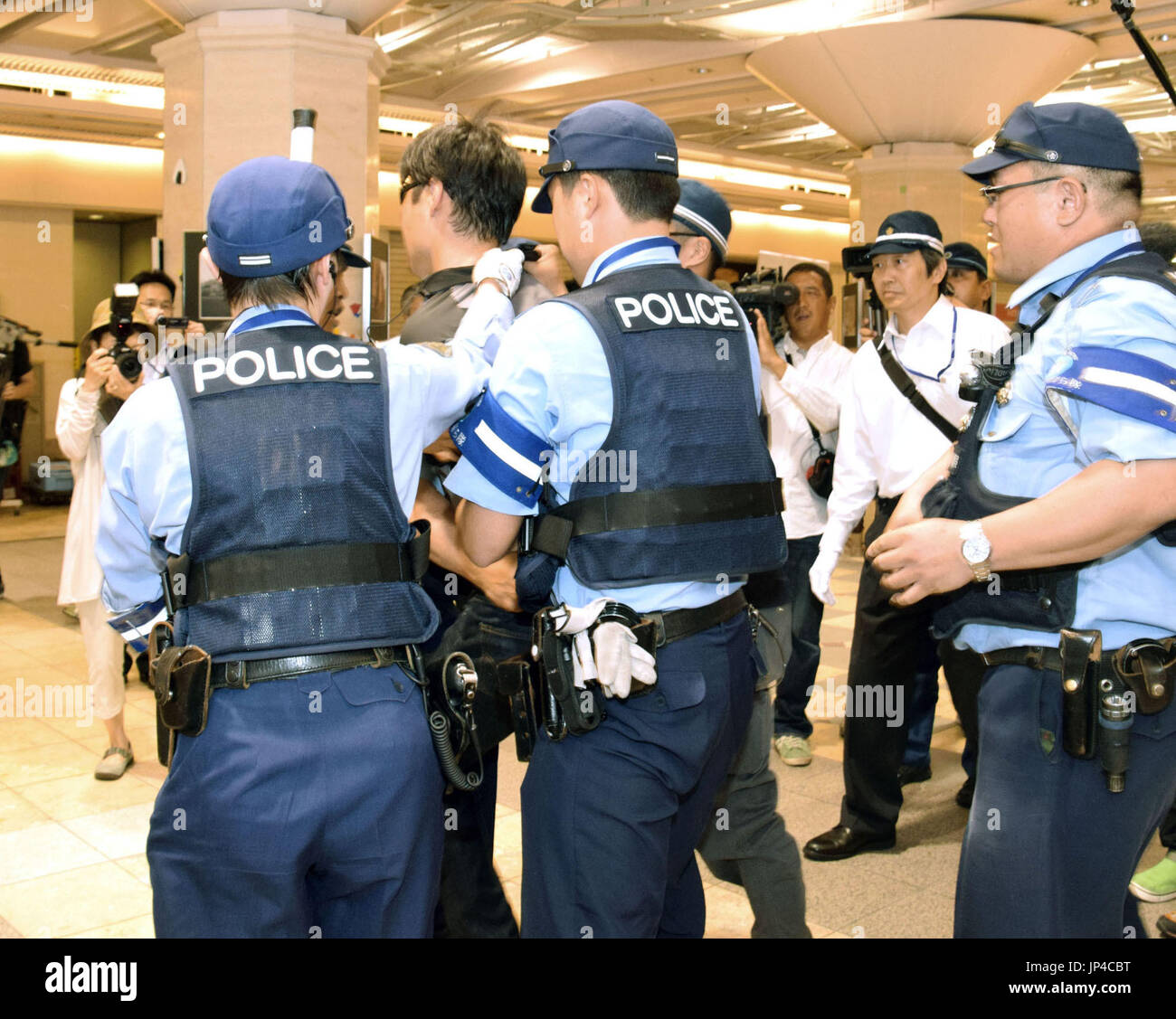 KYOTO, Japan - A man playing the role of a stalker is taken into ...