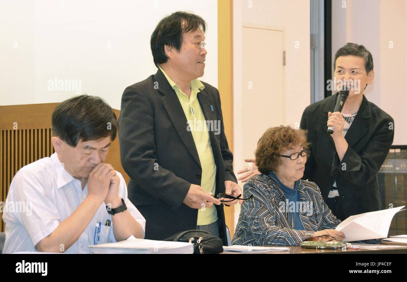 OMU, Japan - Yuko Kitakoshi (R), whose father and three brothers may ...