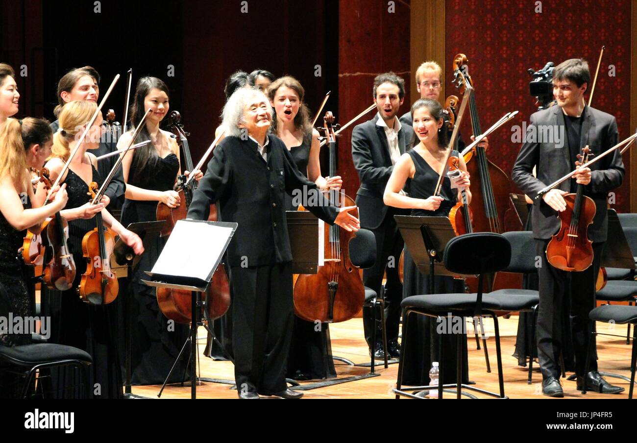 GENEVA, Switzerland - Japanese conductor Seiji Ozawa receives a ...