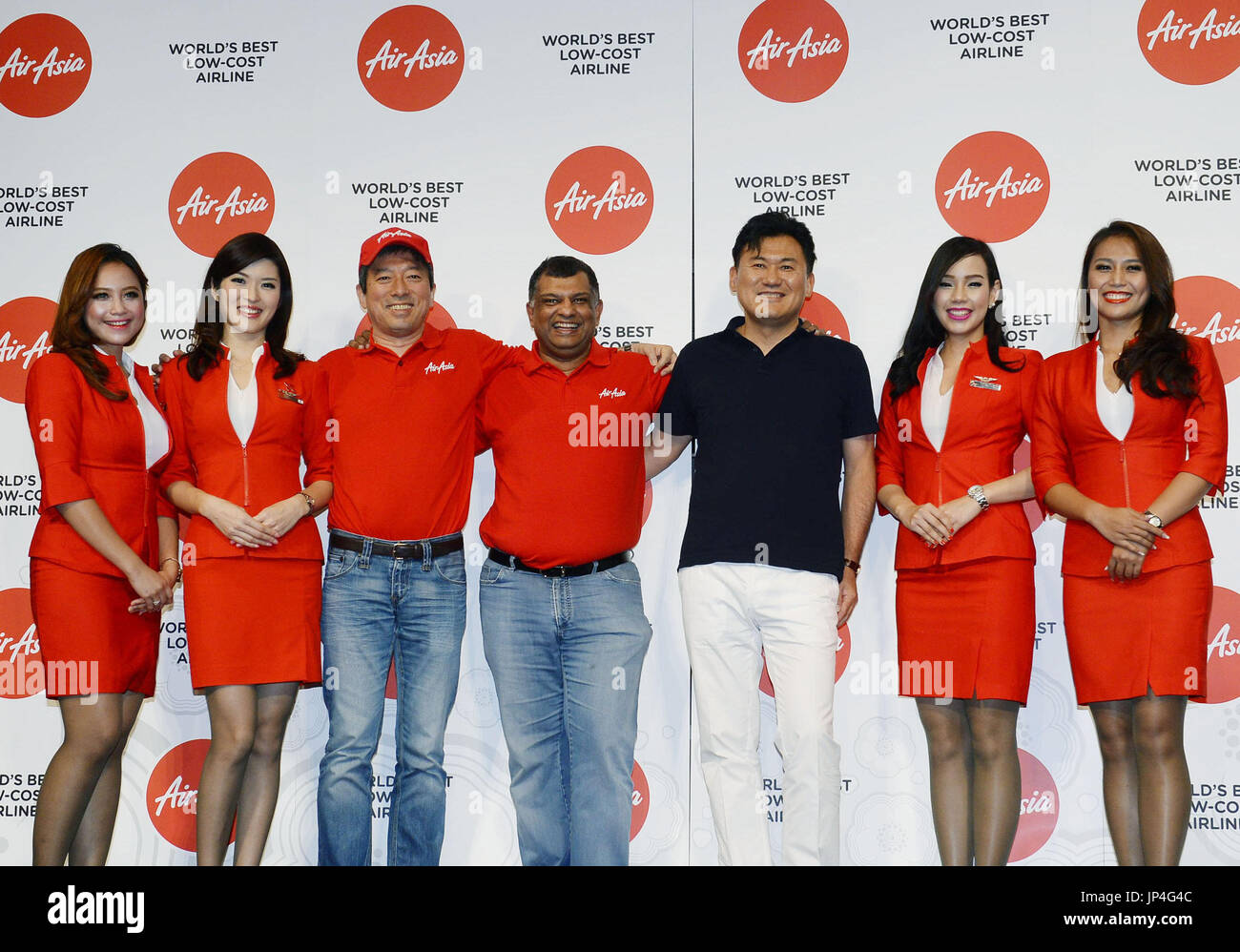 TOKYO, Japan - AirAsia Group Chief Executive Officer Tony Fernandes (C ...