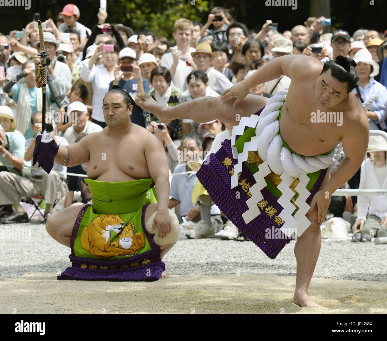 NAGOYA, Japan - Yokozuna Harumafuji performs his ring-entering ritual ...