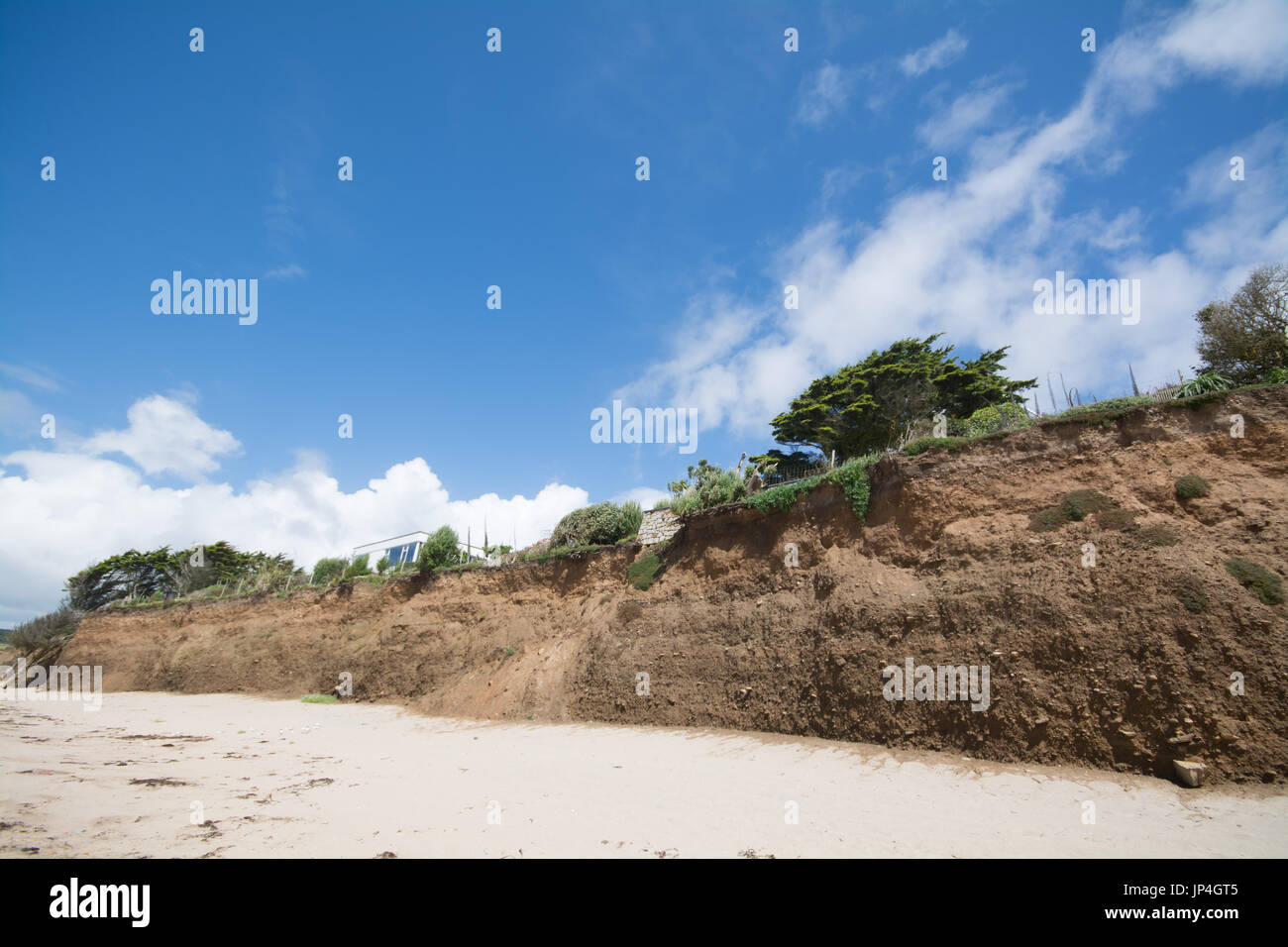 Eroding cliff and house garden at beach in Cornwall Stock Photo - Alamy