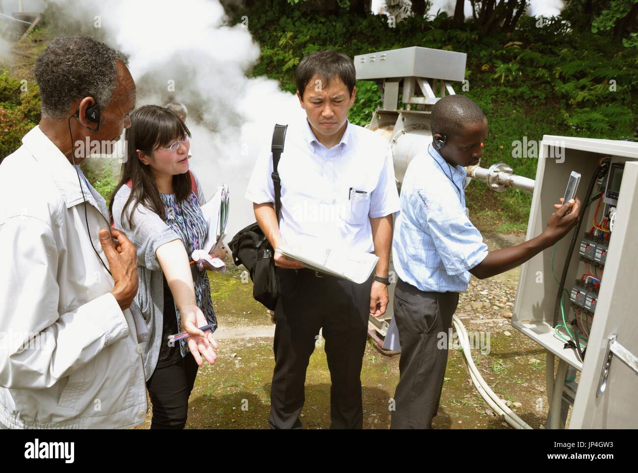 BEPPU, Japan - Engineers from five East African nations examine a hot ...