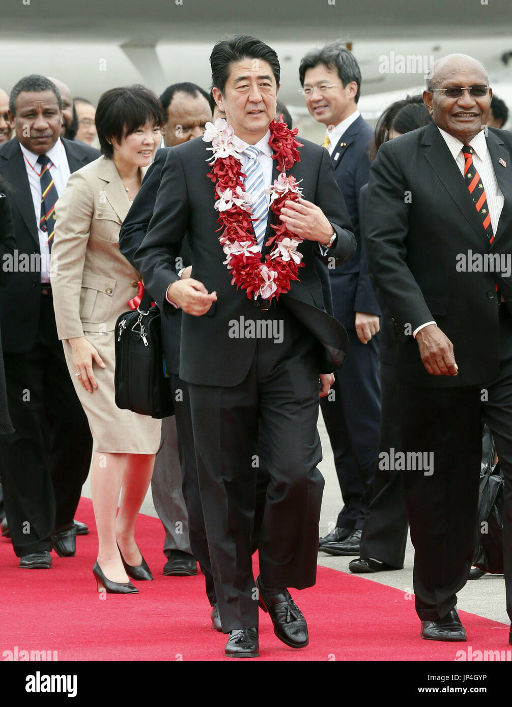 PORT MORESBY, Papua New Guinea - Japanese Prime Minister Shinzo Abe (C ...
