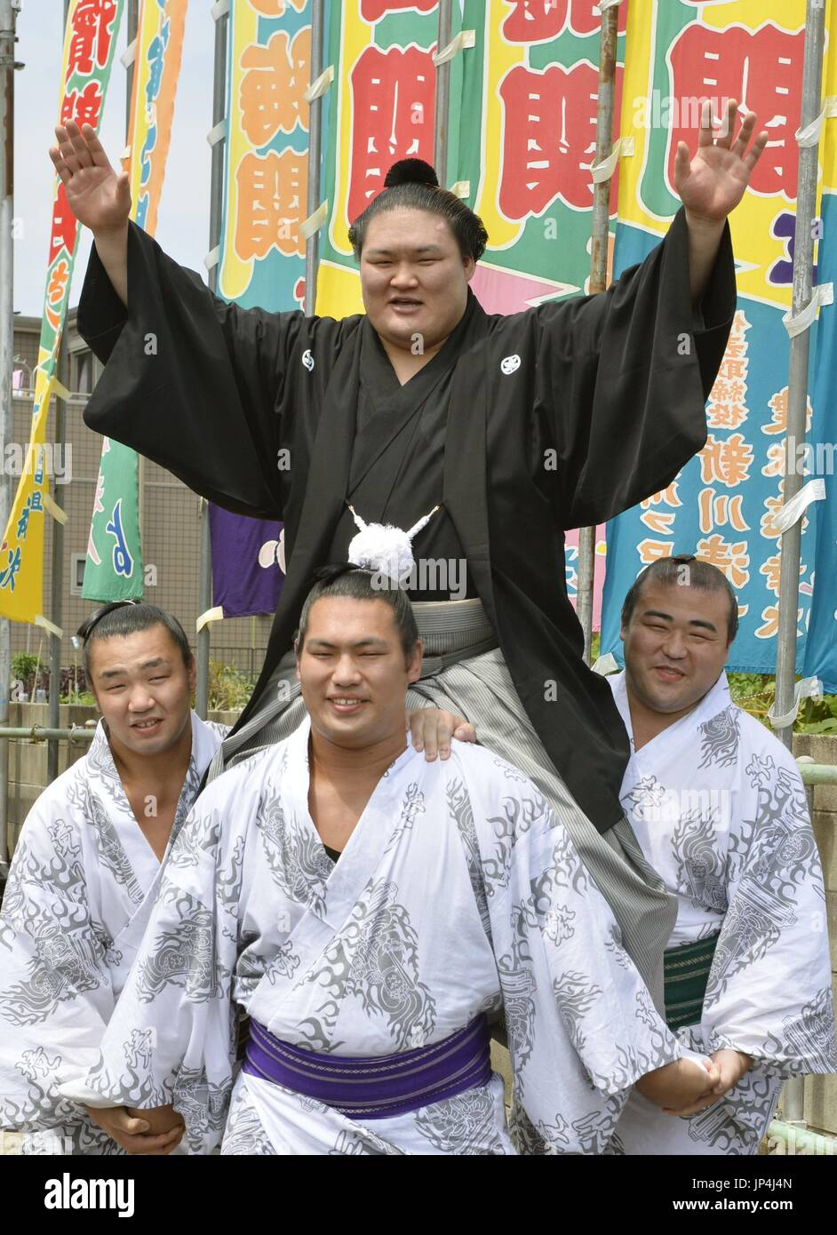 FUSO, Japan - Sumo wrestler Goeido (back) poses for photos with junior ...