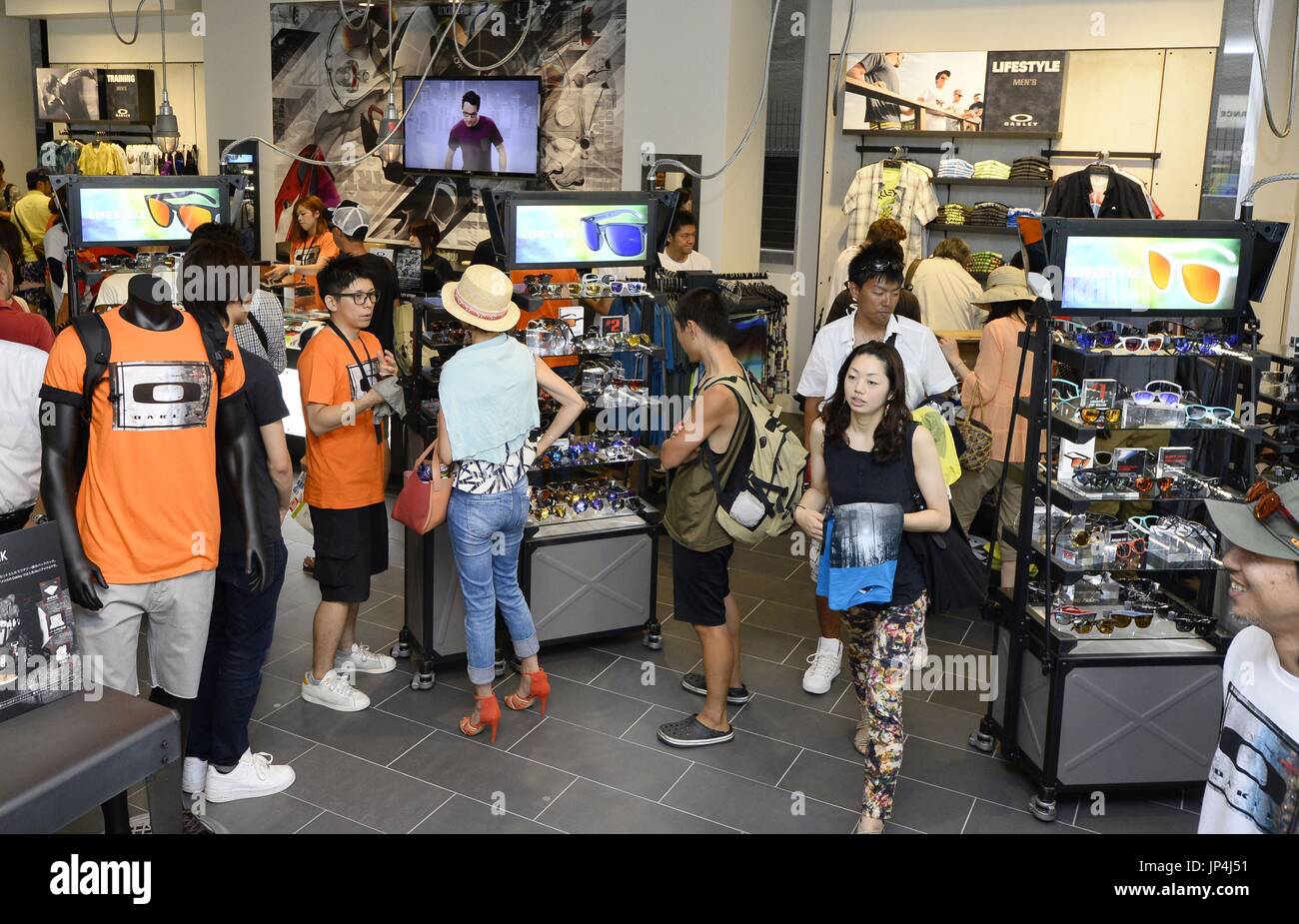 OSAKA, Japan - Shoppers visit the first flagship store of Oakley Japan ...