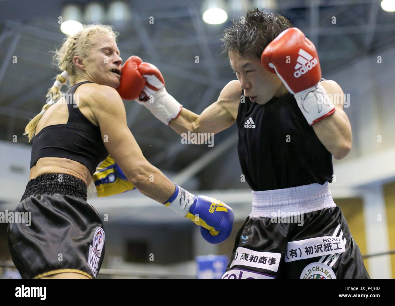 TOKYO, Japan - Champion Momo Koseki of Japan (R) delivers a punch to ...