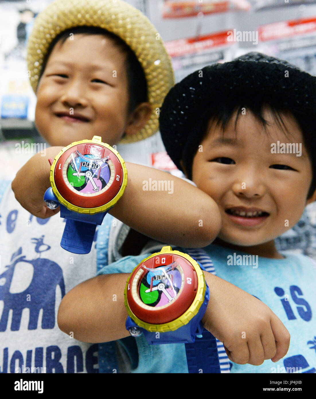 TOKYO, Japan - Brothers show off their wristwatch-type toys, DX specter ...
