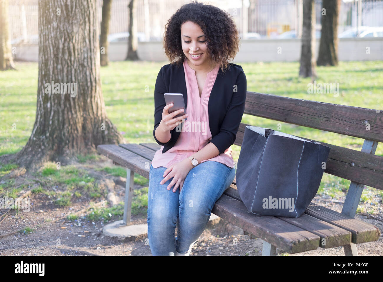 Black female teen cell phone hi-res stock photography and images - Alamy