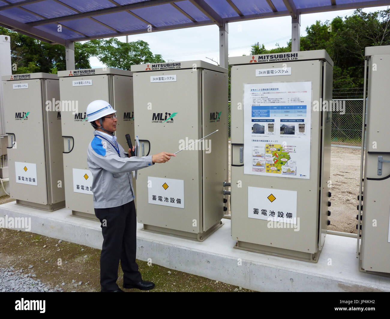 FUKUOKA, Japan - A Kyushu Electric Power Co. official shows storage ...