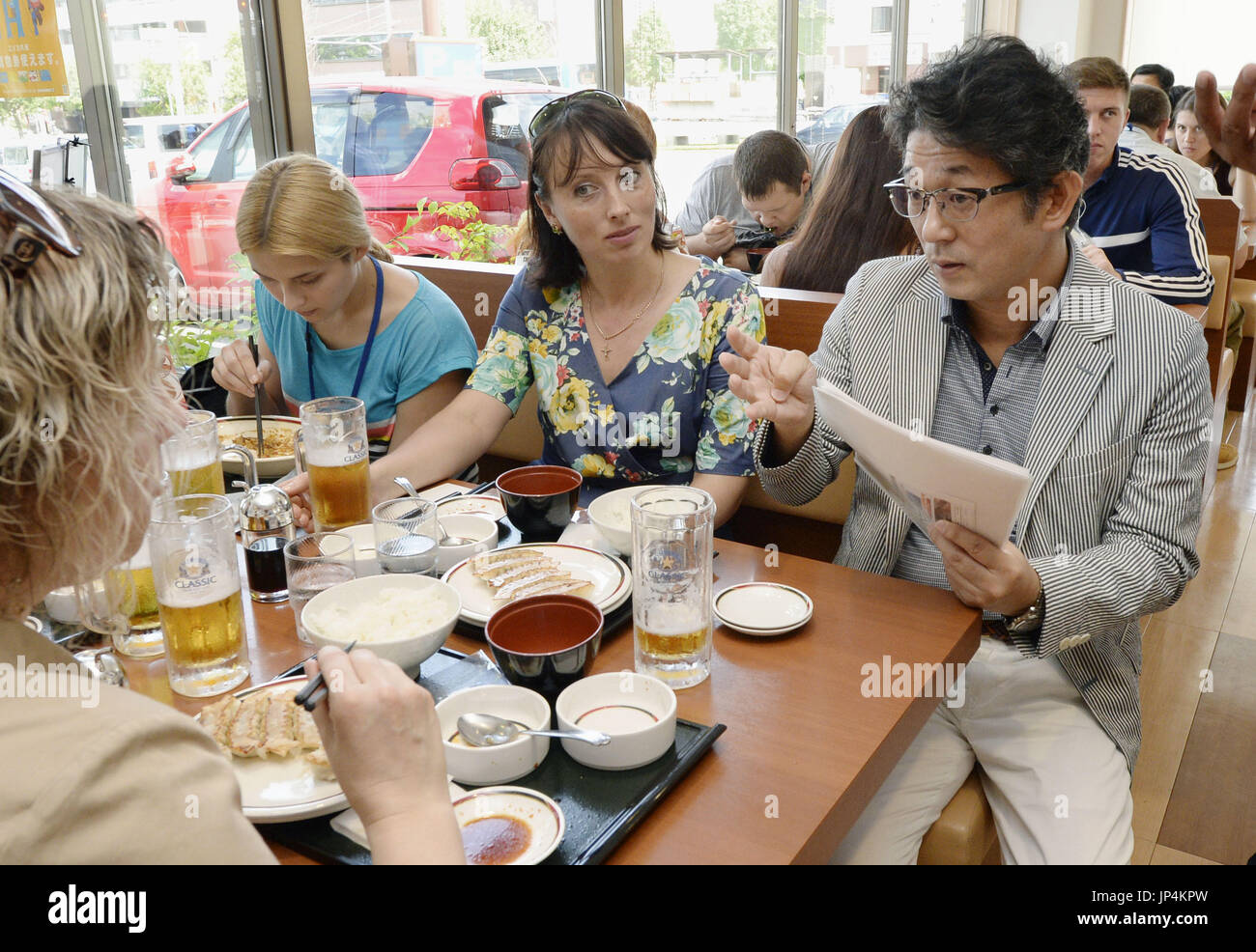 SAPPORO, Japan - Osamu Nishida (R), president of a restaurant chain ...