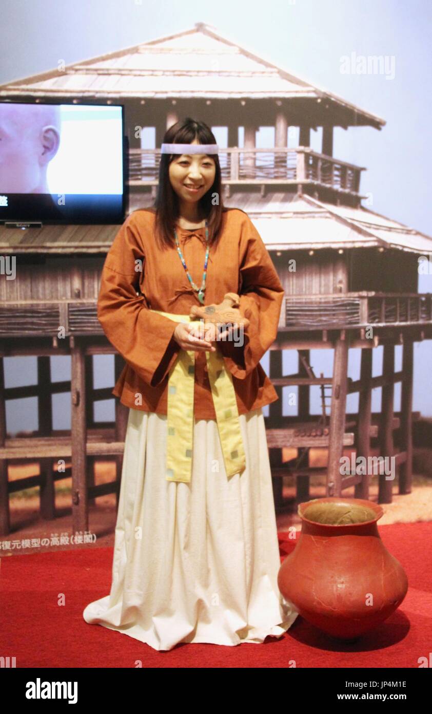 CHIBA, Japan - A woman wears a garment of the Yayoi period at the try ...