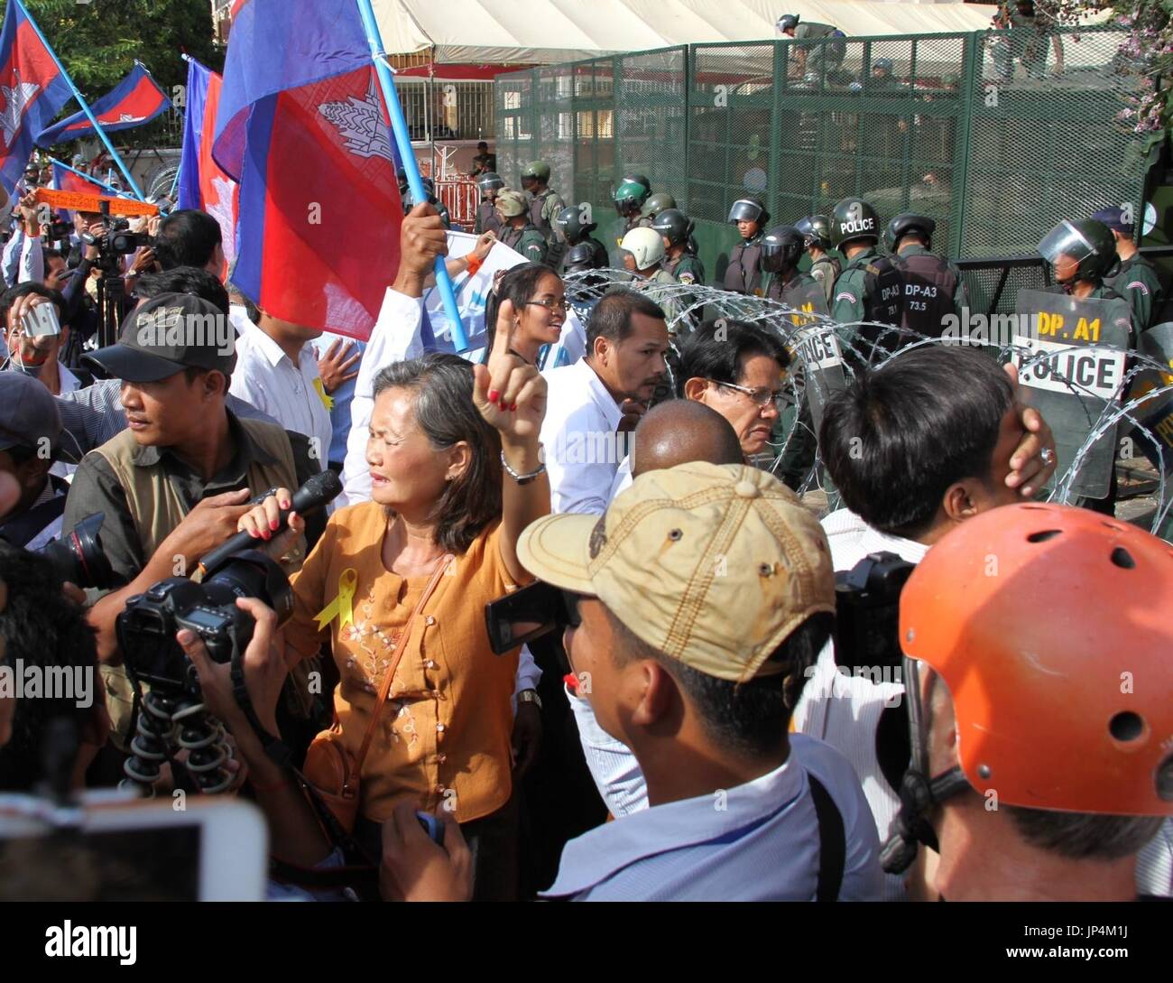 PHNOM PENH, Cambodia - Mu Sochua (center, holding microphone), a ...