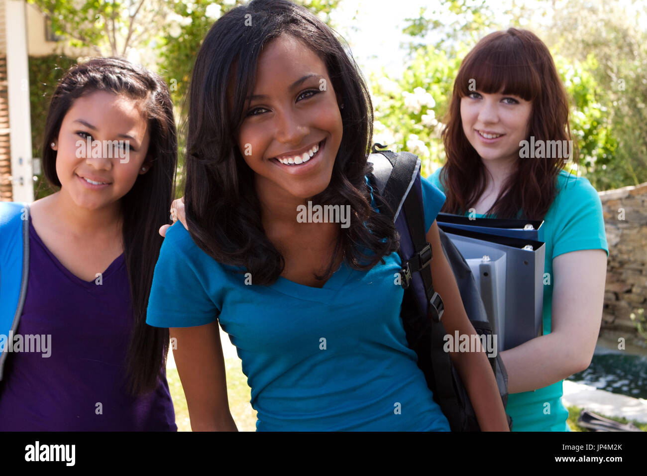 Portrait of teenage girls going back to school Stock Photo - Alamy