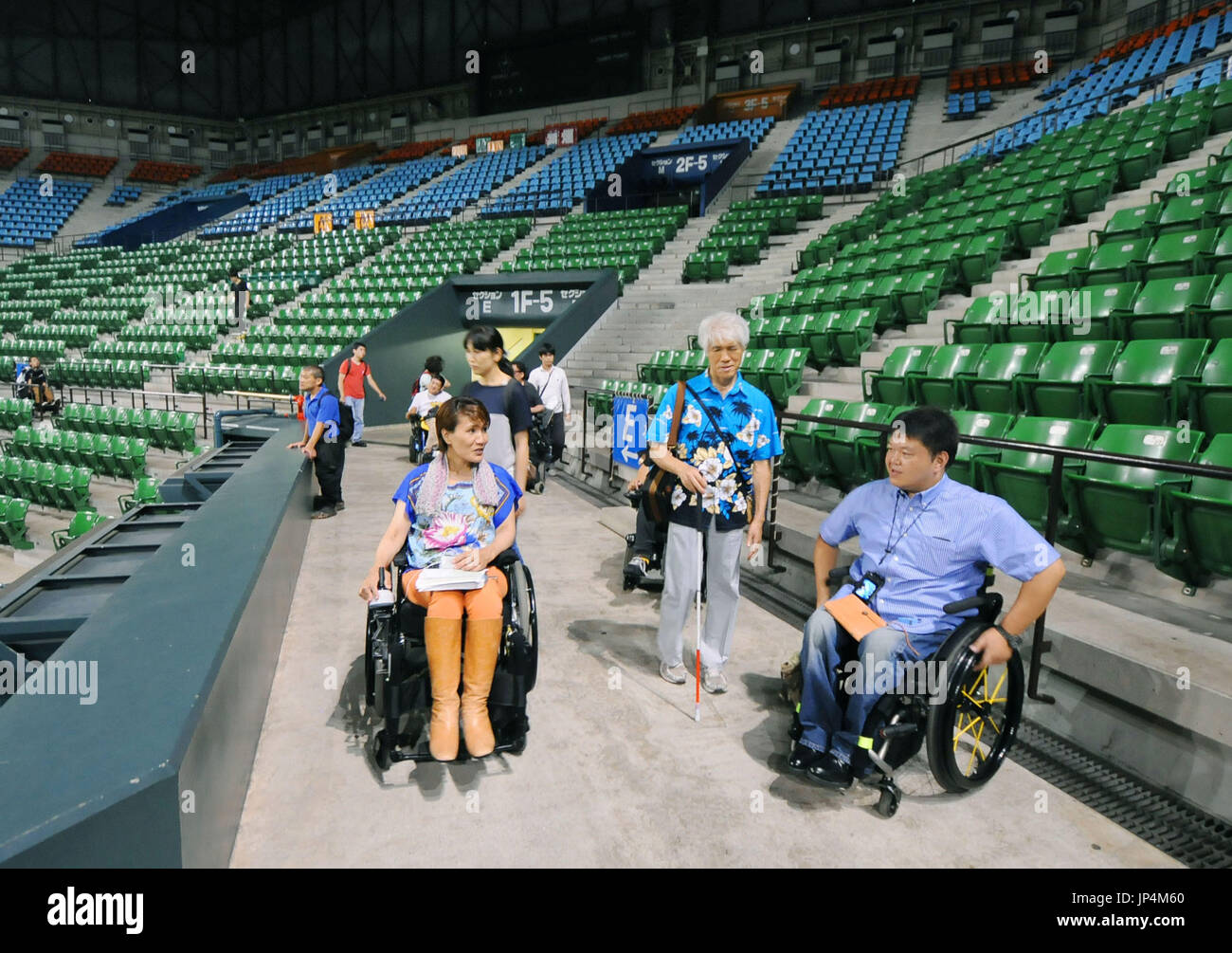TOKYO, Japan - A group of handicapped people checks the accessibility ...