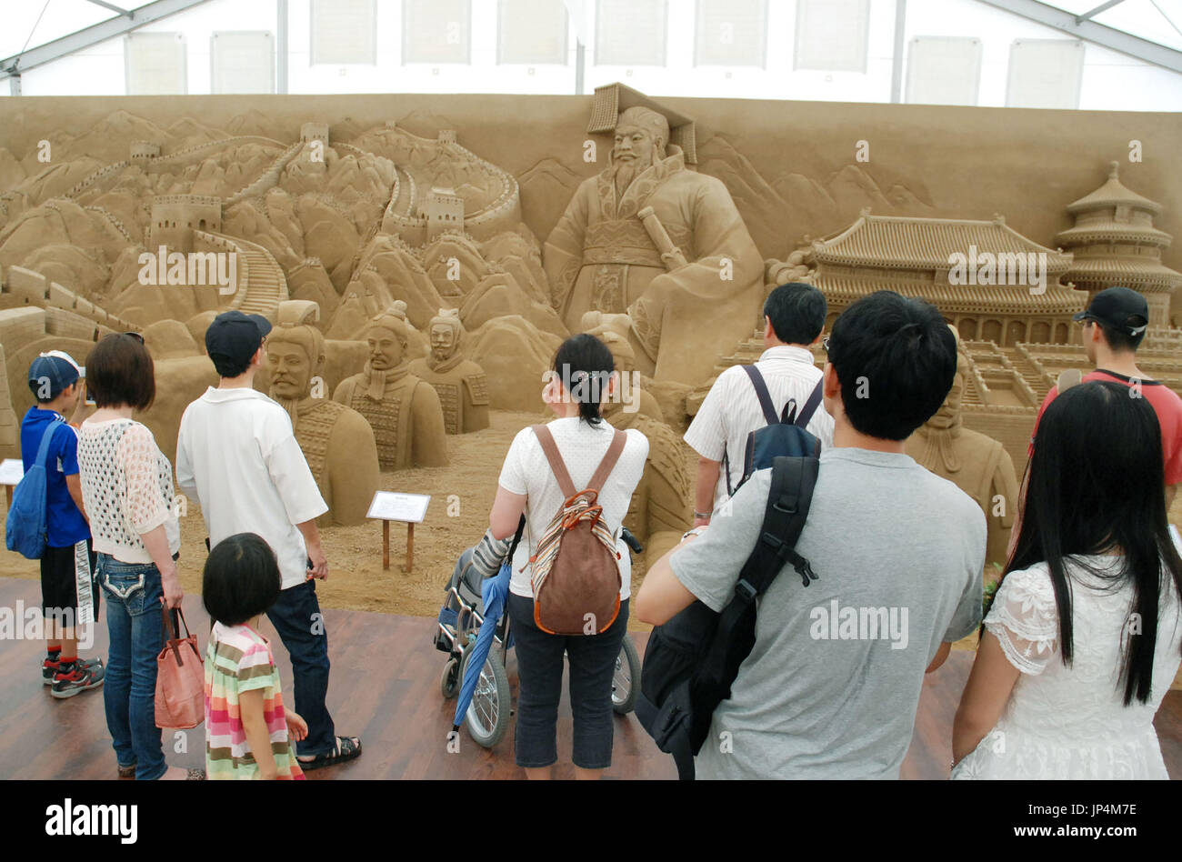 YOKOHAMA, Japan - Visitors look at sand sculptures at the Sand Art ...