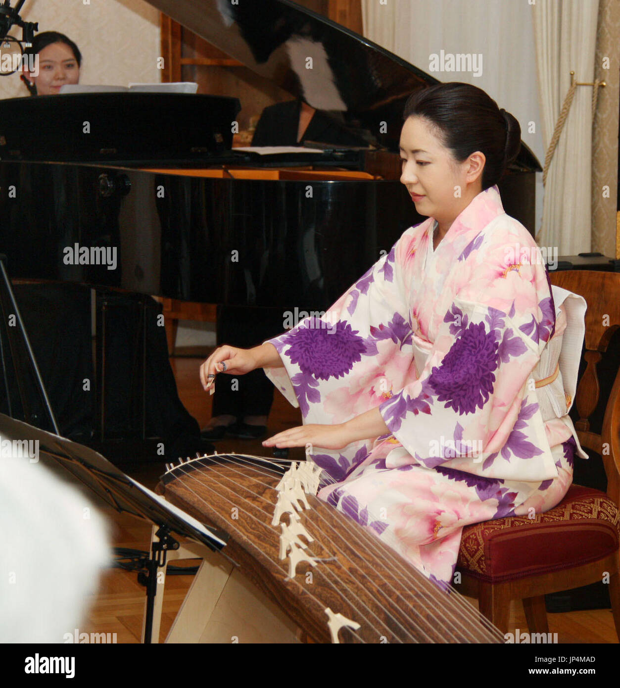 VIENNA, Austria - Japanese "koto" (harp) player Fuyuki Enokido and ...