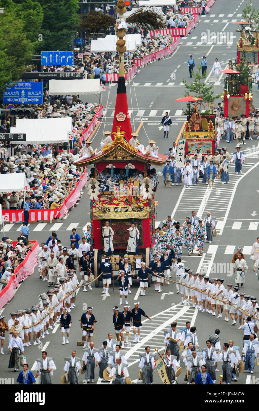 KYOTO, Japan - Photo shows a procession led by the Naginata-hoko float ...