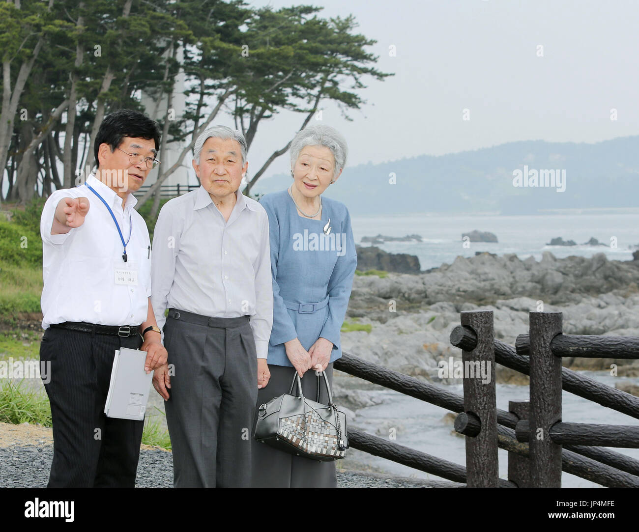 KESENNUMA, Japan - Japanese Emperor Akihito (C) and Empress Michiko (R ...