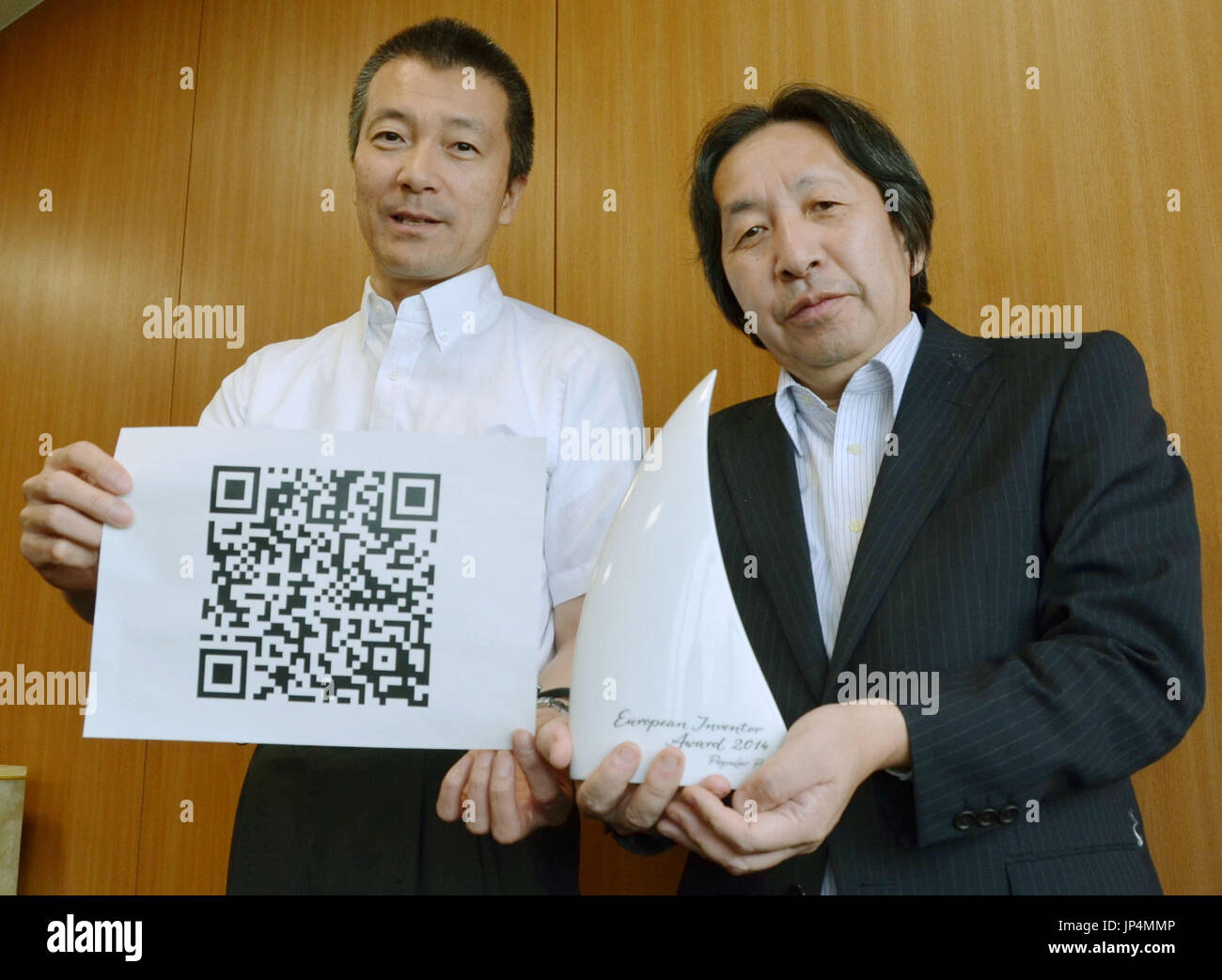 NAGOYA, Japan - Masahiro Hara (R) of Denso Wave Inc. and Takayuki ...