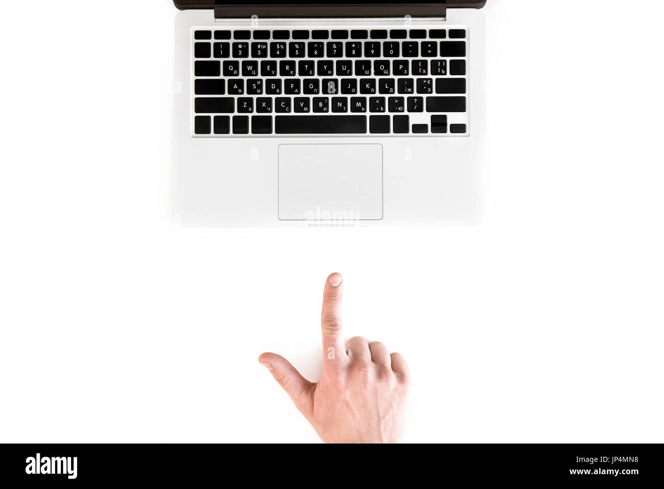 top view of human hand pointing at laptop computer isolated on white ...