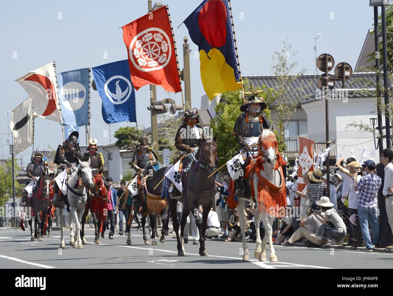 SOMA, Japan - Horsemen clad in armor and helmets parade in the city of ...
