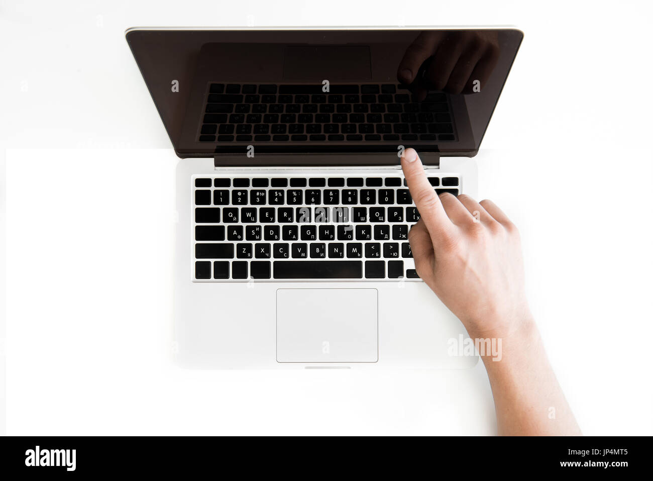 top view of human hand pointing at laptop computer isolated on white ...