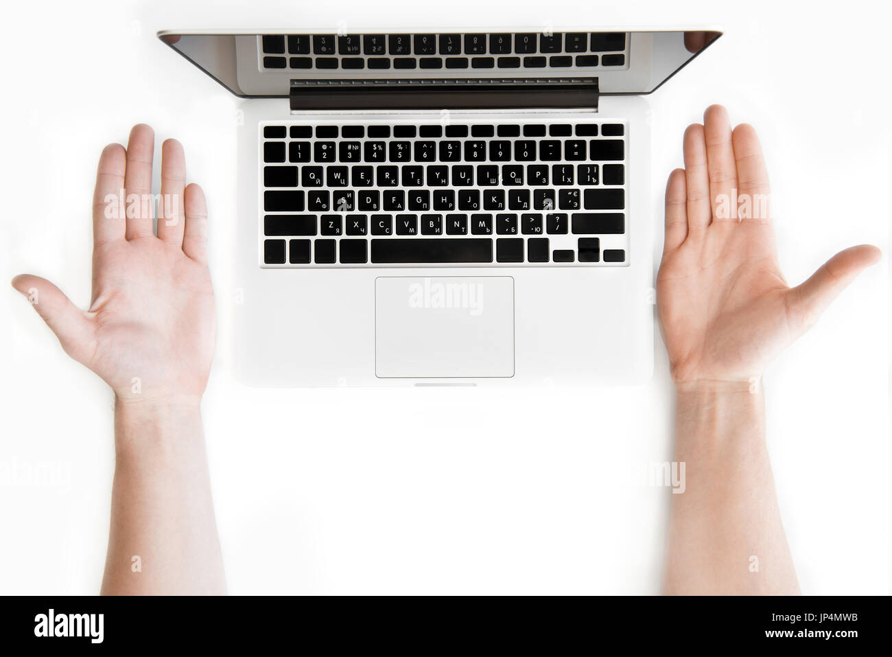 top view of human hands presenting laptop computer isolated on white ...