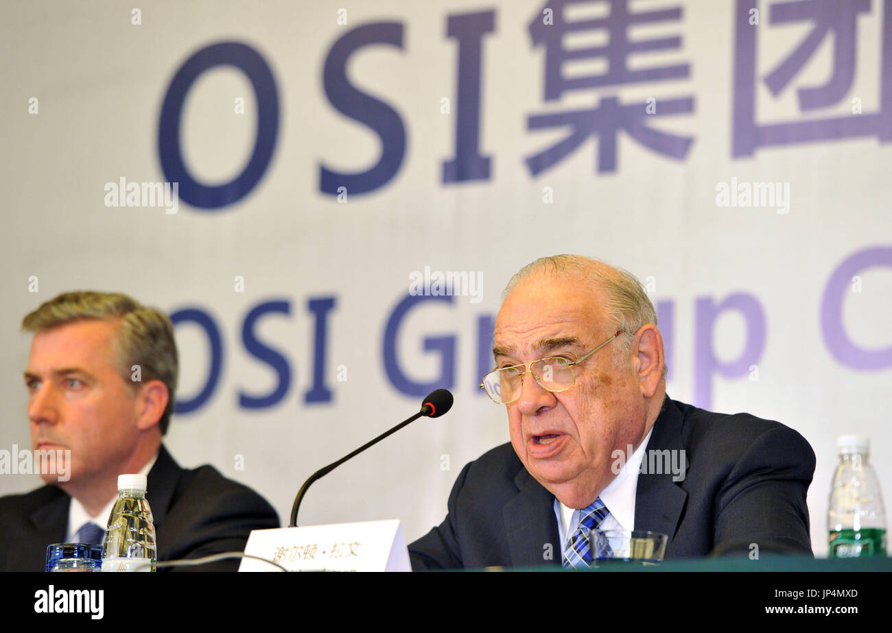 SHANGHAI, China - Sheldon Lavin (R), chief executive officer of OSI ...
