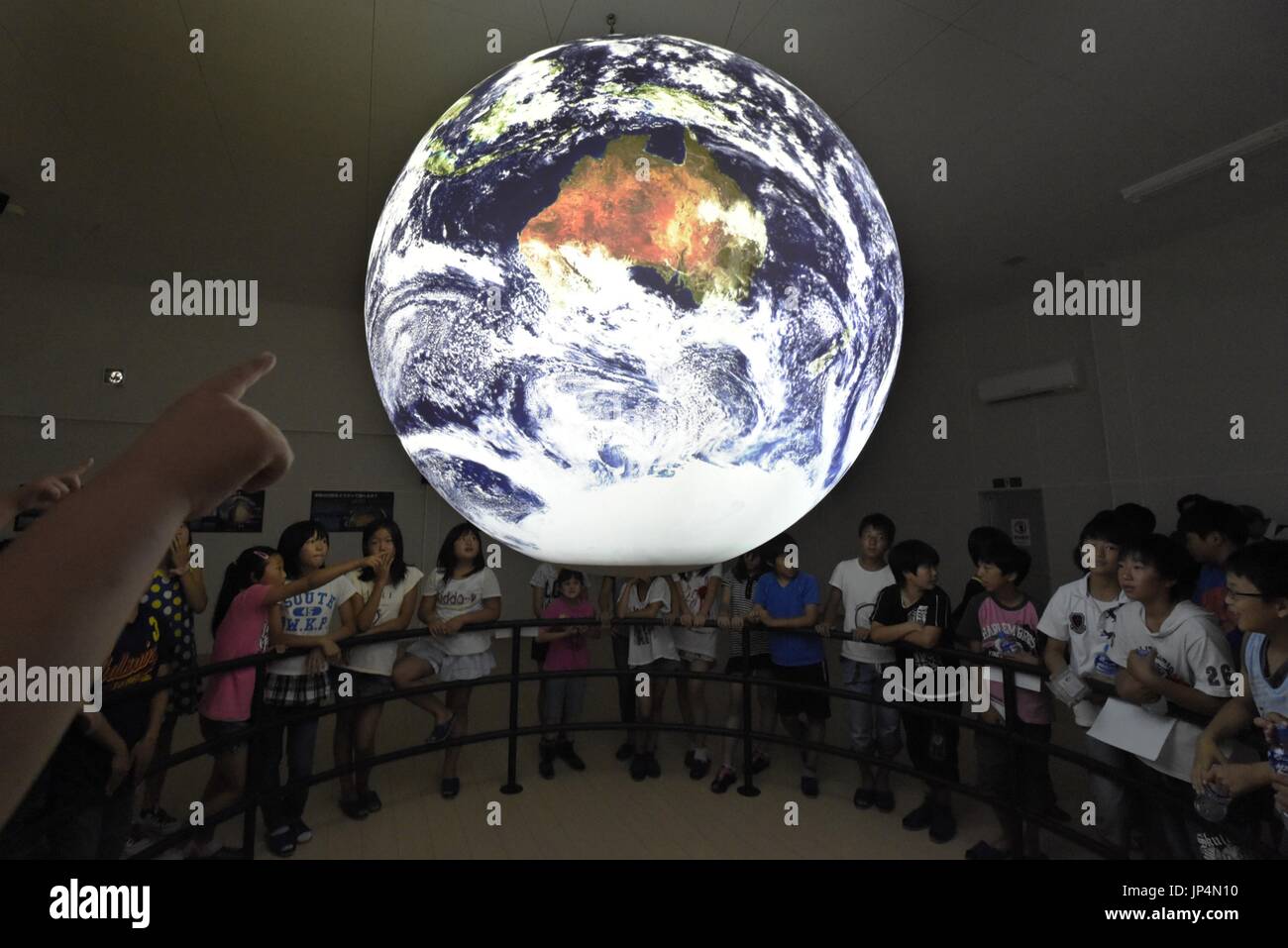 HIGASHIMATSUSHIMA, Japan - Pupils look at "Science On a Sphere ...