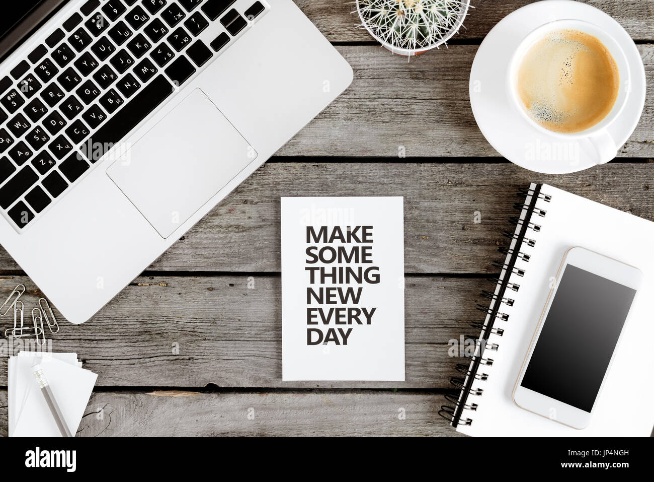 flat lay with Make something new everyday motivational quote on modern ...