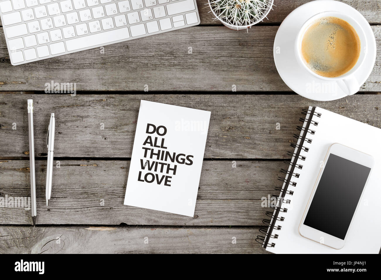 flat lay with Do all things with love motivational quote on modern ...