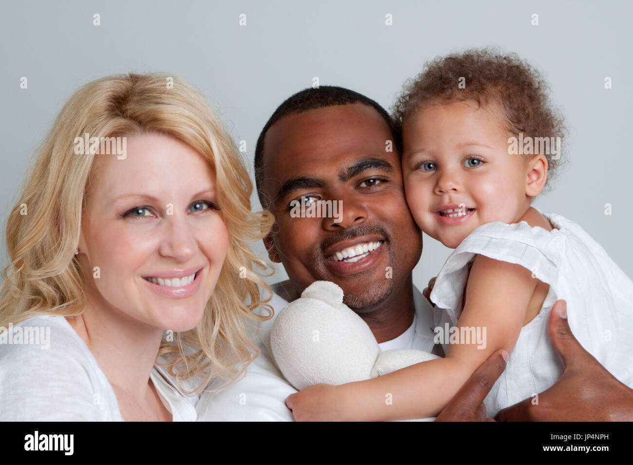 Portrait of a biracial family isolated on white Stock Photo - Alamy
