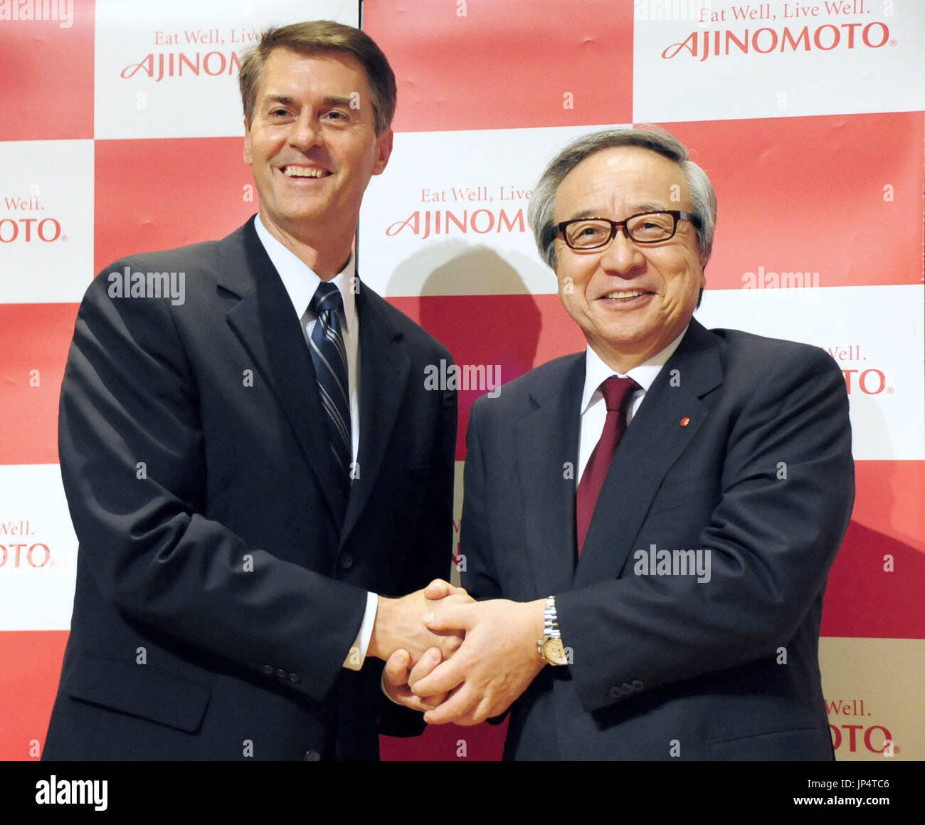 TOKYO, Japan - Masatoshi Ito (R), president of Ajinomoto Co., and Greg ...