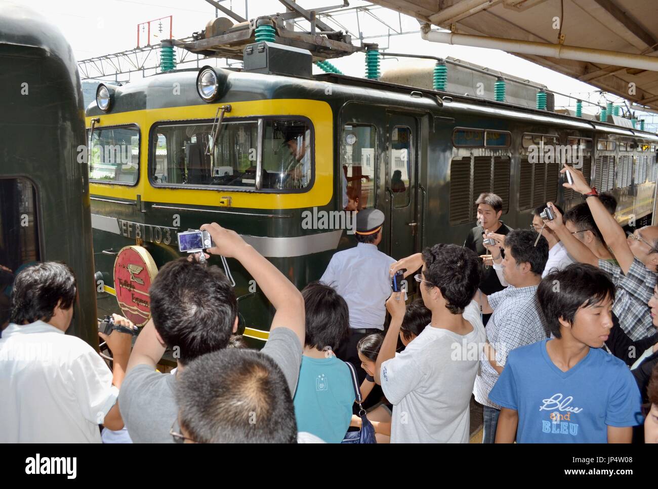 TSURUGA, Japan - Railway enthusiasts watch a locomotive changed for the ...