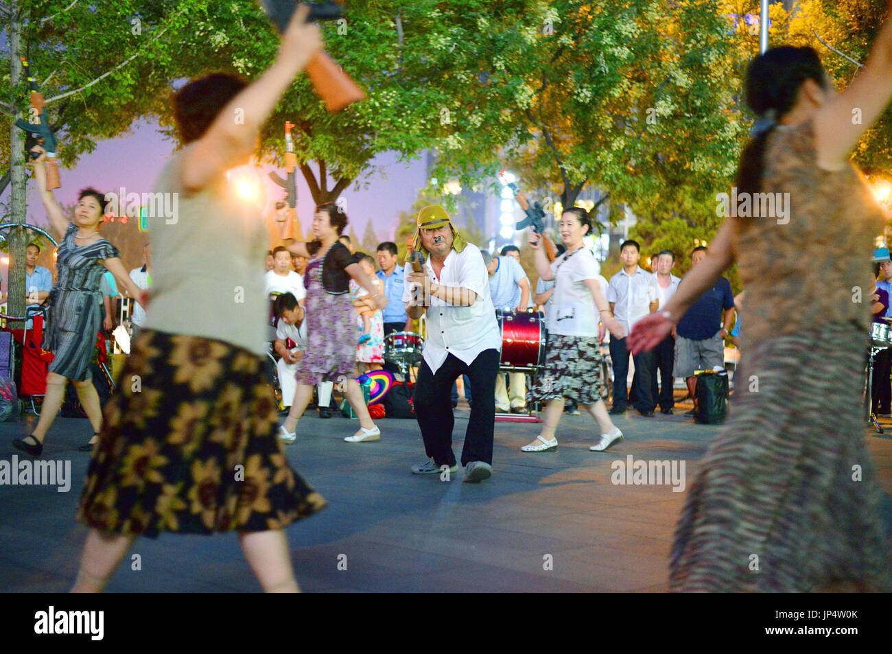 BEIJING, China - Middle-aged Chinese women, known as "dama," holding ...